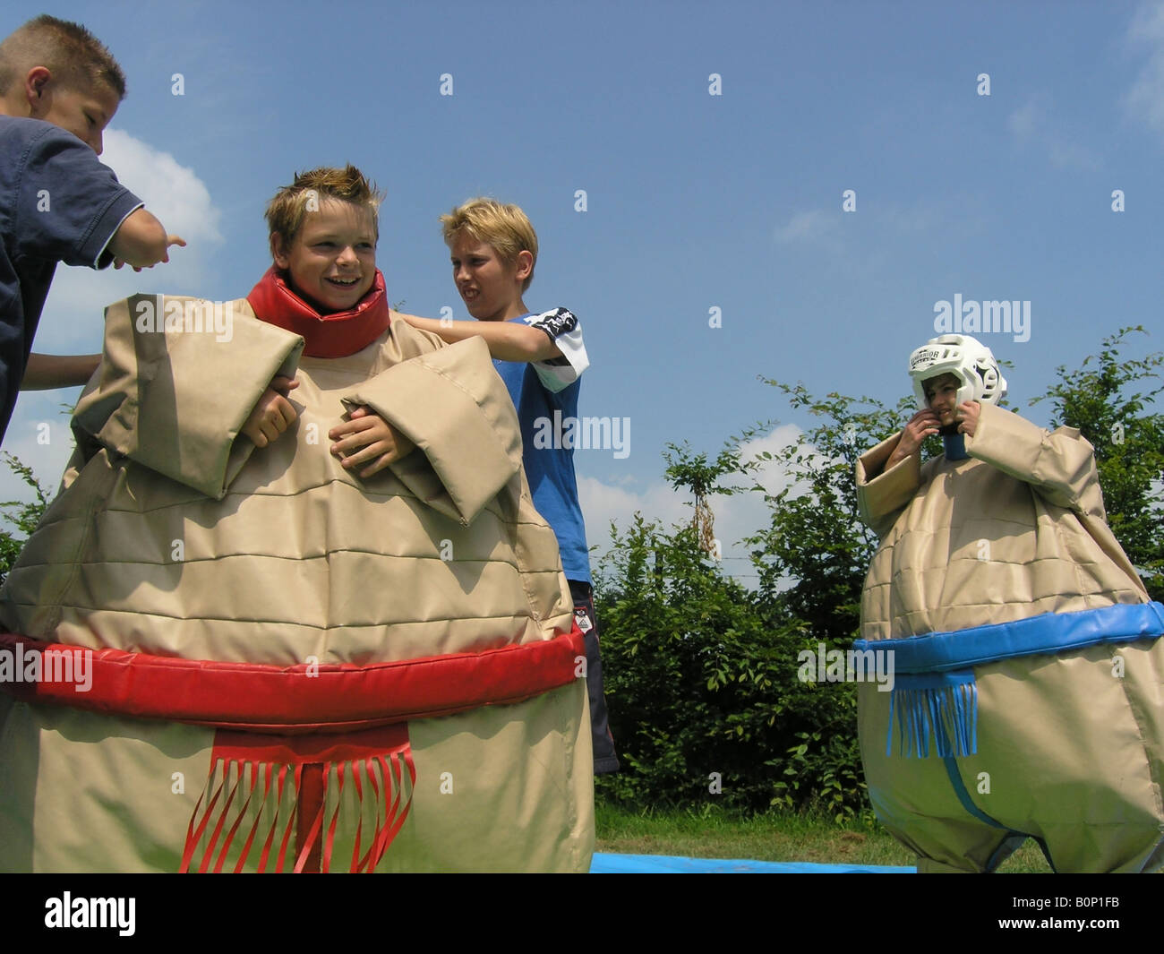 teenage student sumo wrestling at school camp Stock Photo - Alamy
