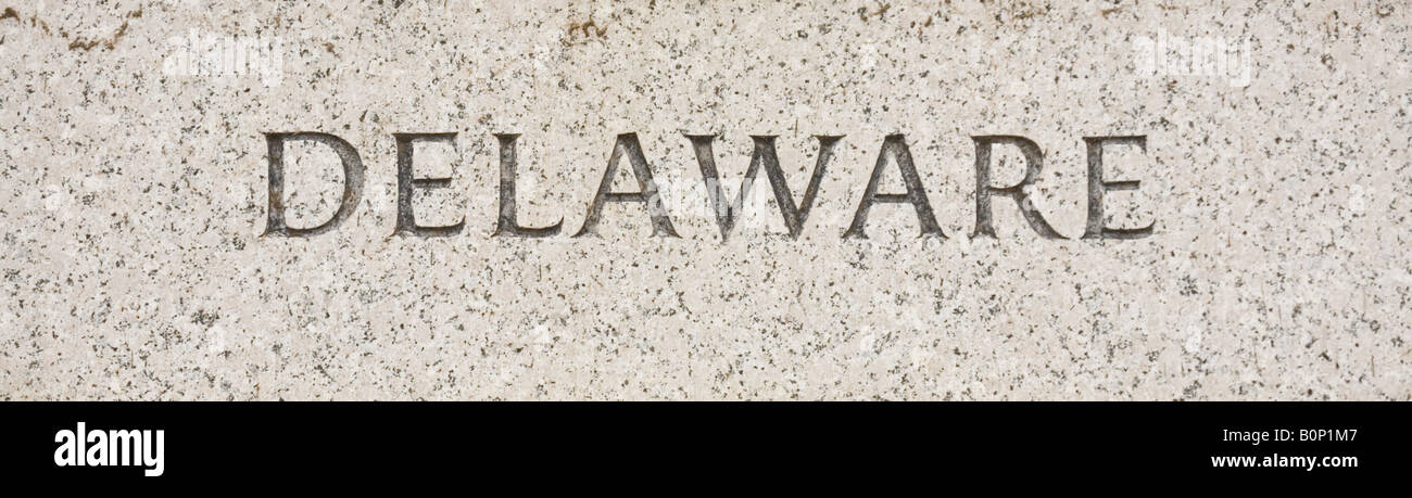Delaware state name written in grey granite stone Stock Photo - Alamy