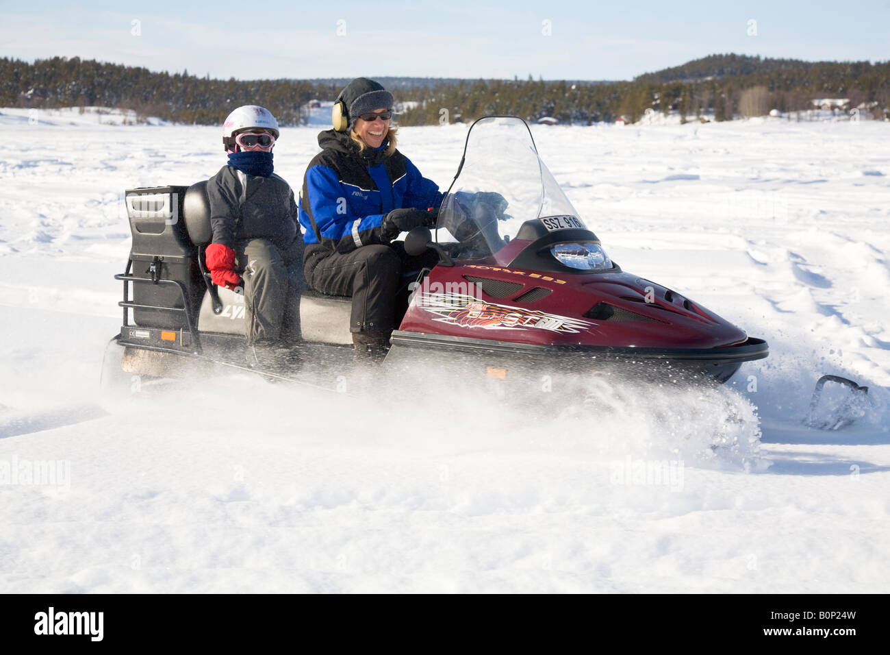 Child and snowmobile hi-res stock photography and images - Alamy