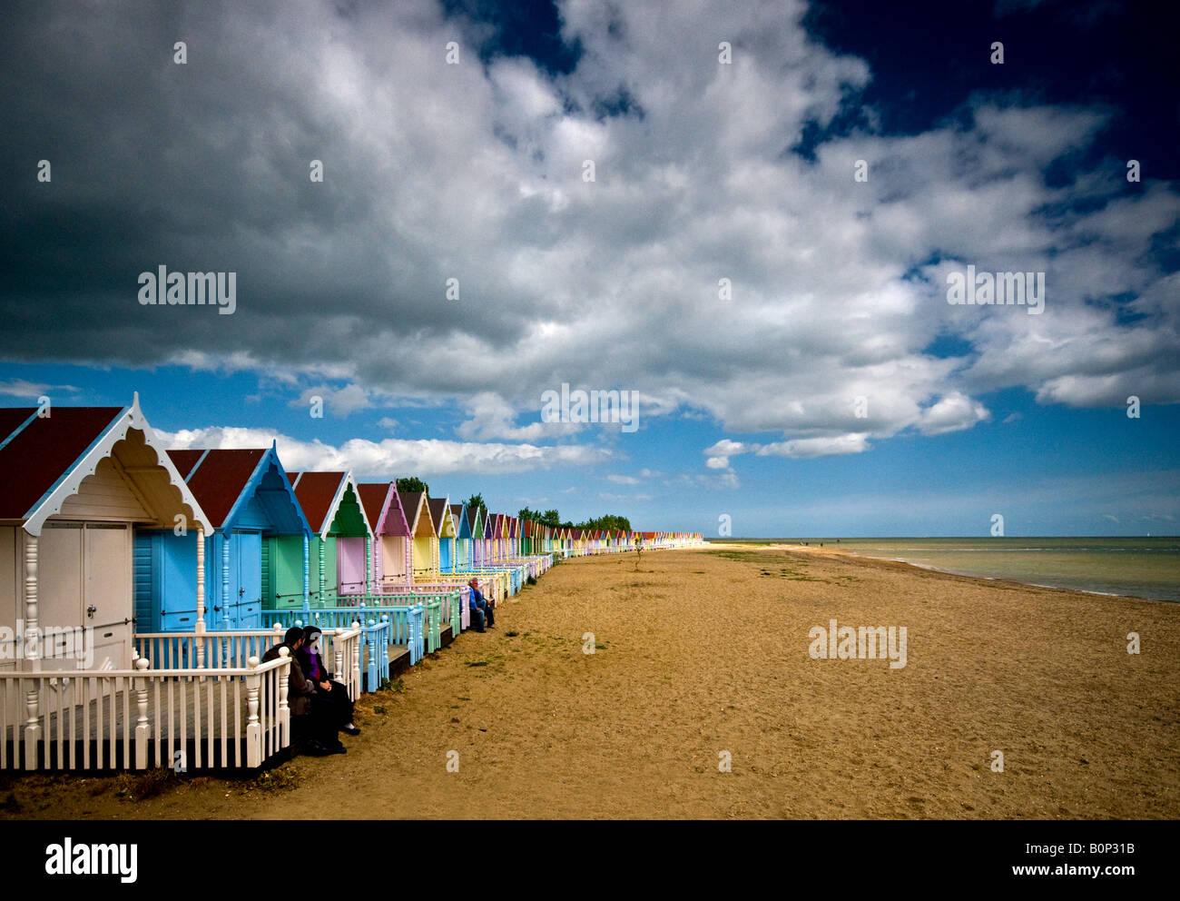 A row of colourful Beach Huts on West Mersea beach in Essex Stock Photo ...