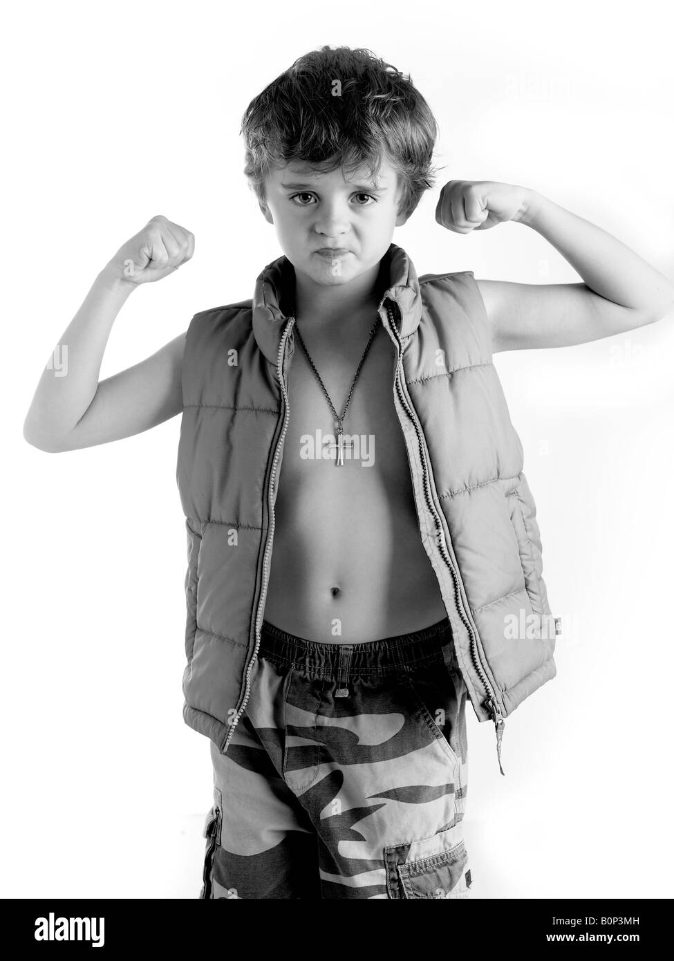 boy wearing chain with cross hanging on it looking tough Stock Photo ...