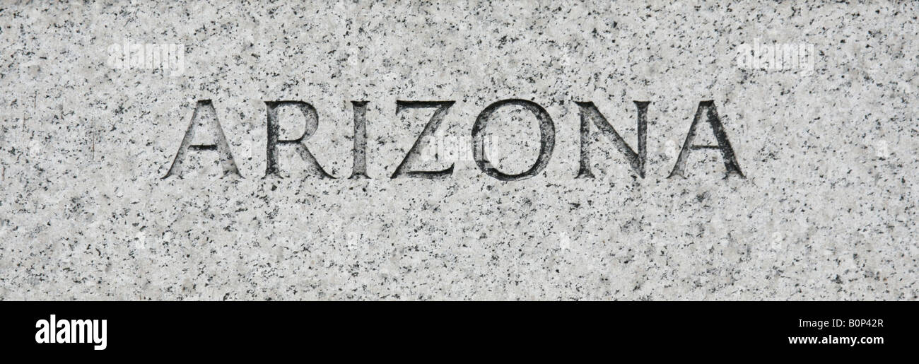 Arizona state name written in grey granite stone Stock Photo - Alamy
