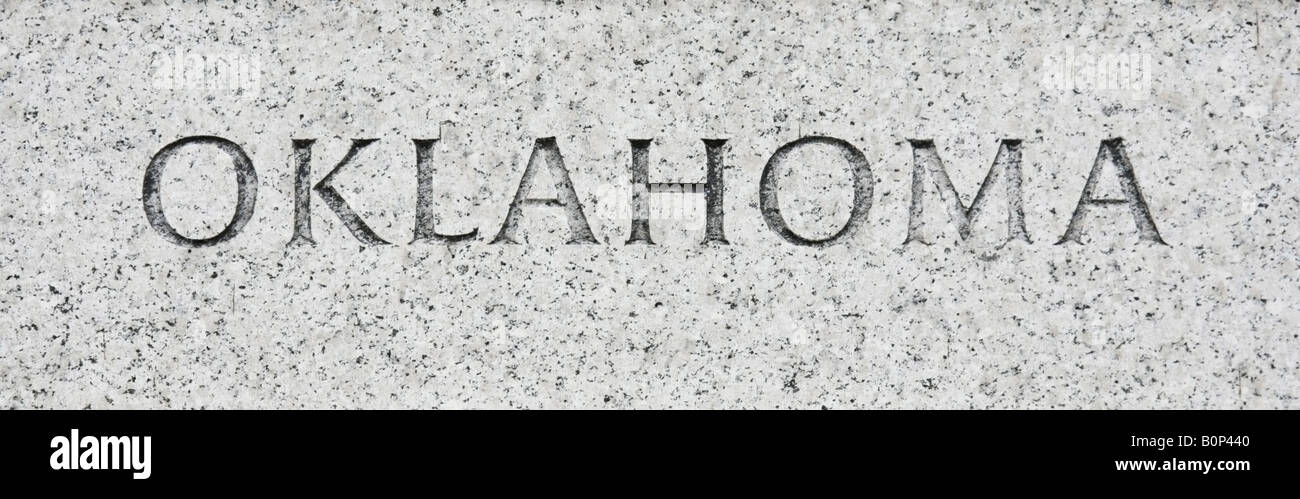 Oklahoma state name written in grey granite stone Stock Photo - Alamy