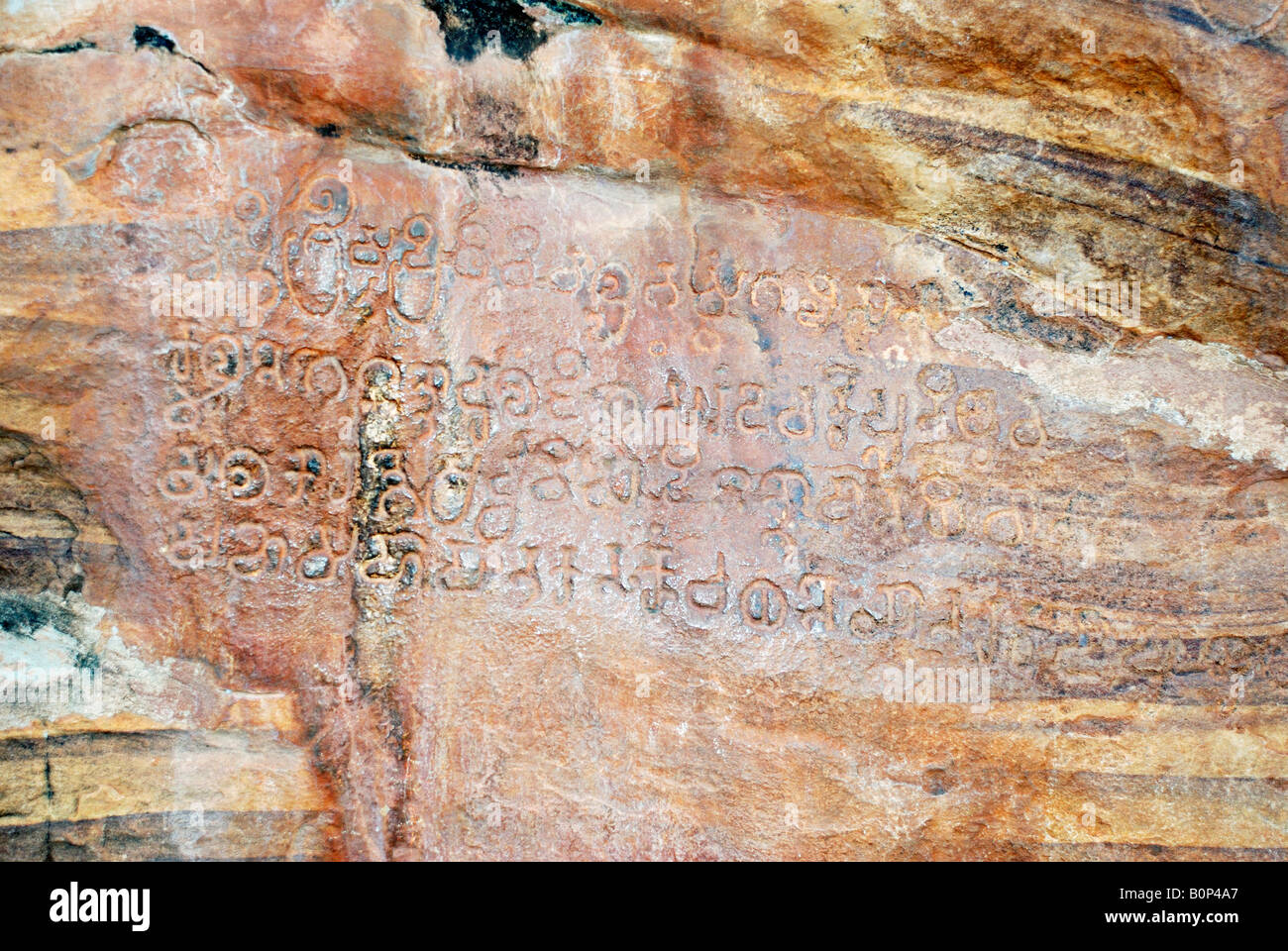Inscription on rocks, Badami caves, Badami, Karnataka, India Stock ...