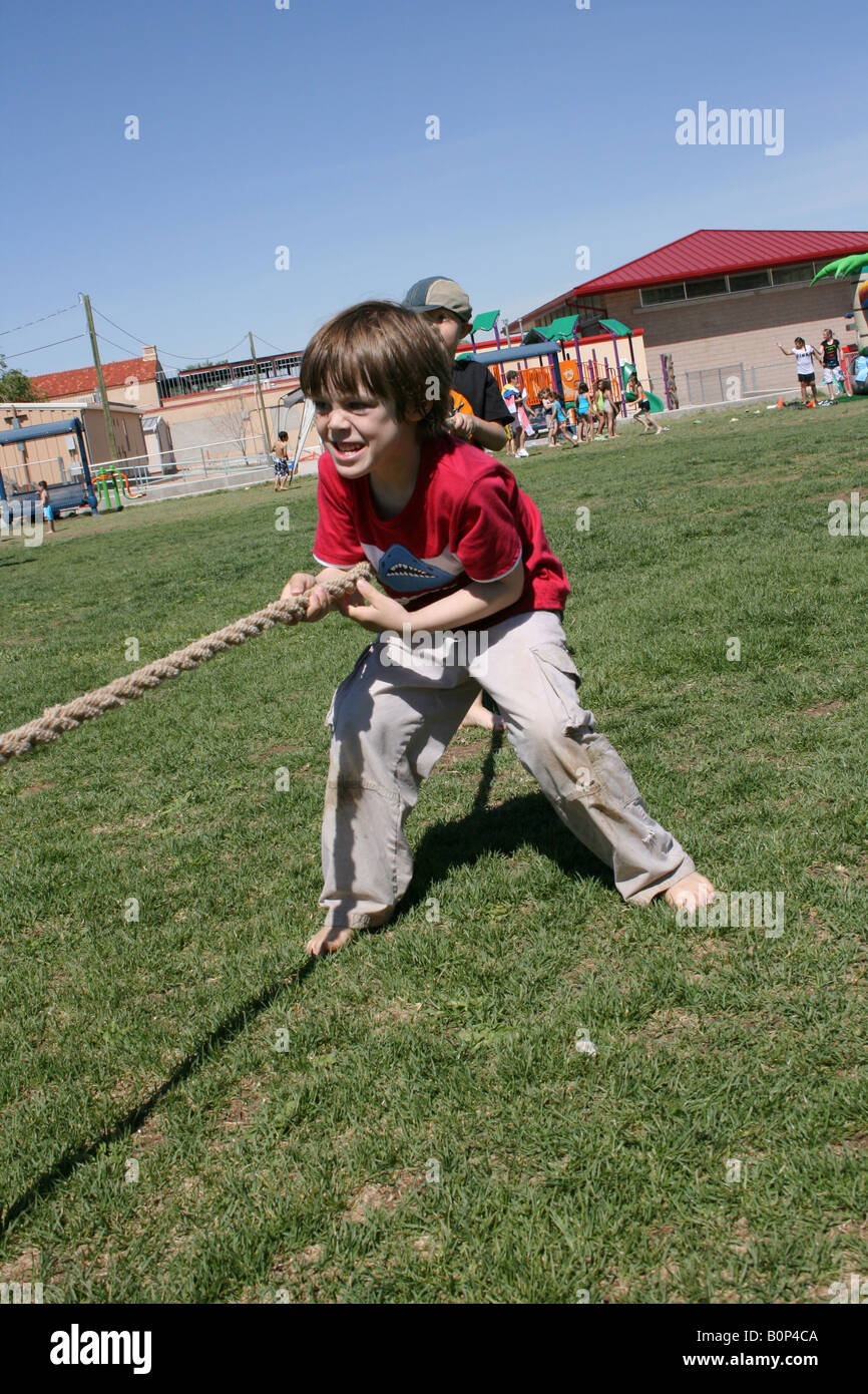 boy pulling rope, tug of war, field day at school Stock Photo - Alamy