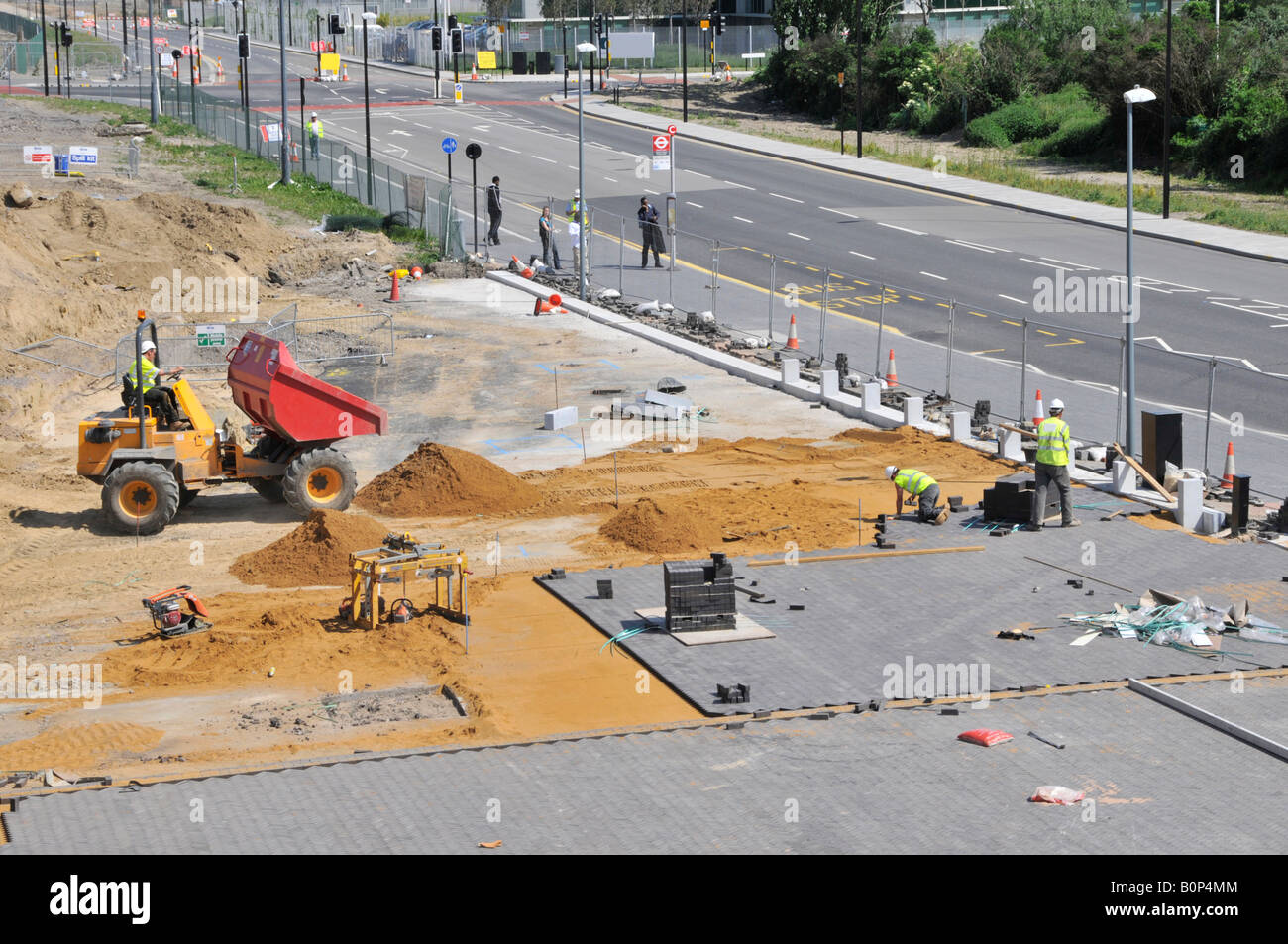 Construction site with dumper truck machine in use on car park block ...