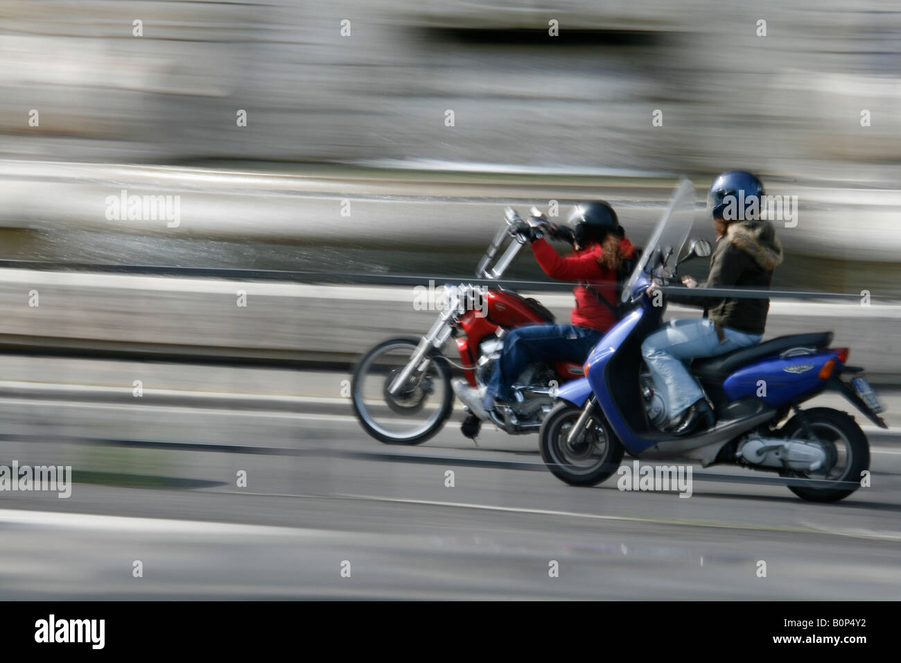 people riding scooters in rome italy Stock Photo - Alamy