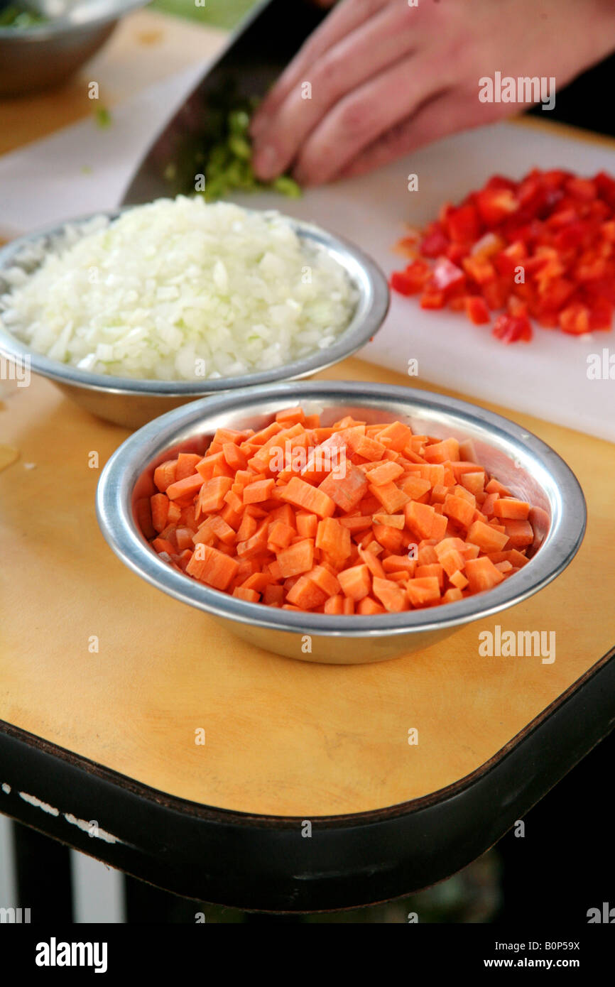 Vegetables to be used as ingredients minced on a table top Stock Photo ...