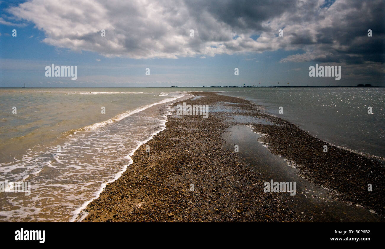 An ebb tide revealing a shingle spit on the Essex coast Stock Photo - Alamy