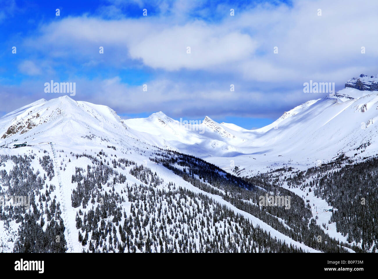 Snowy mountain ridge at Lake Louise ski resort in Canadian Rockies ...
