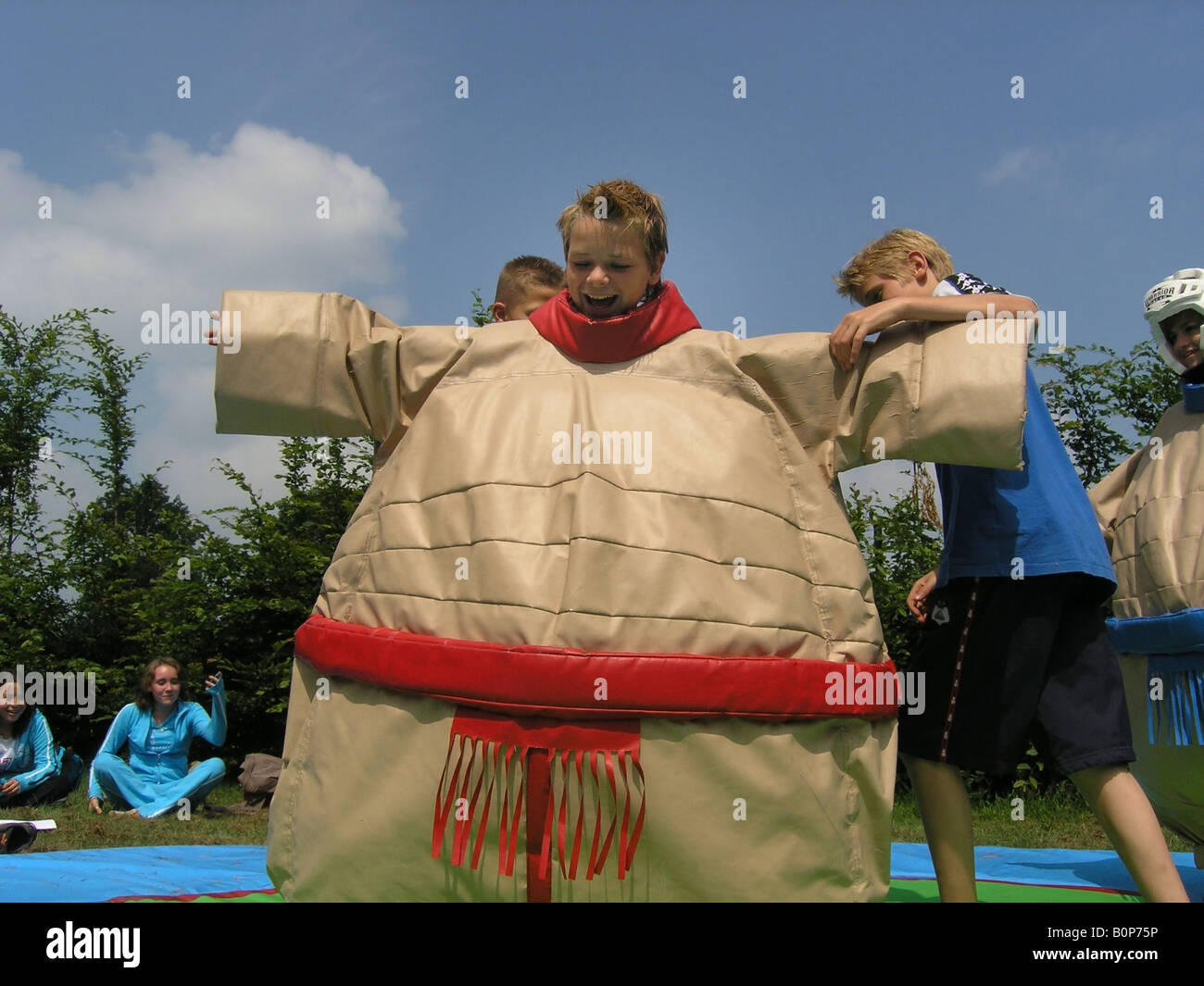 teenage student sumo wrestling at school camp Stock Photo - Alamy