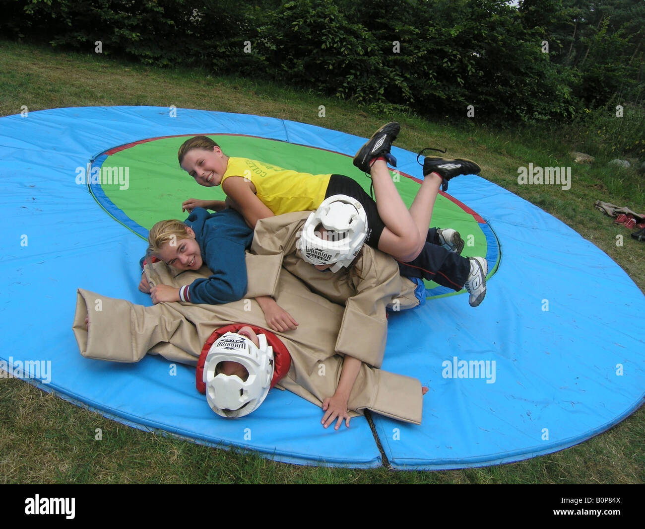 girl students sumo wrestling at school camp Stock Photo - Alamy