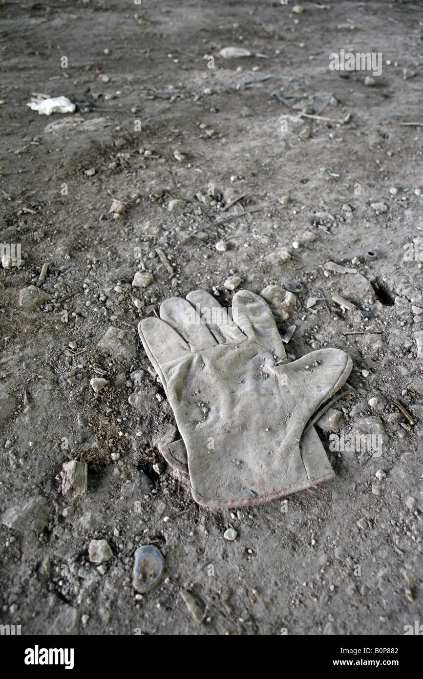 one lost dirty glove on floor Stock Photo - Alamy