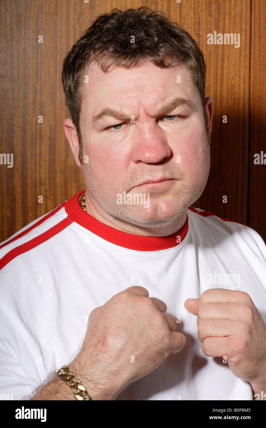 Aggressive looking man ready to fight with fists Stock Photo - Alamy