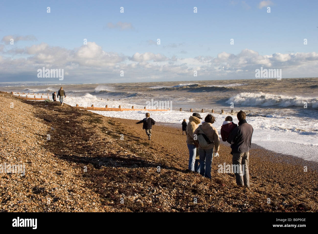 Family watching the sea Stock Photo - Alamy