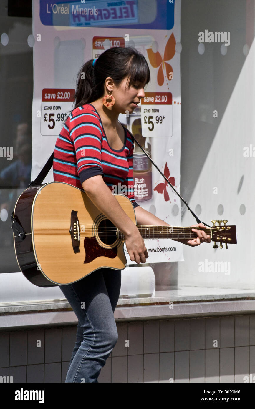 Scottish female musician Sarah Coloso busking in Dundee, UK Stock Photo ...