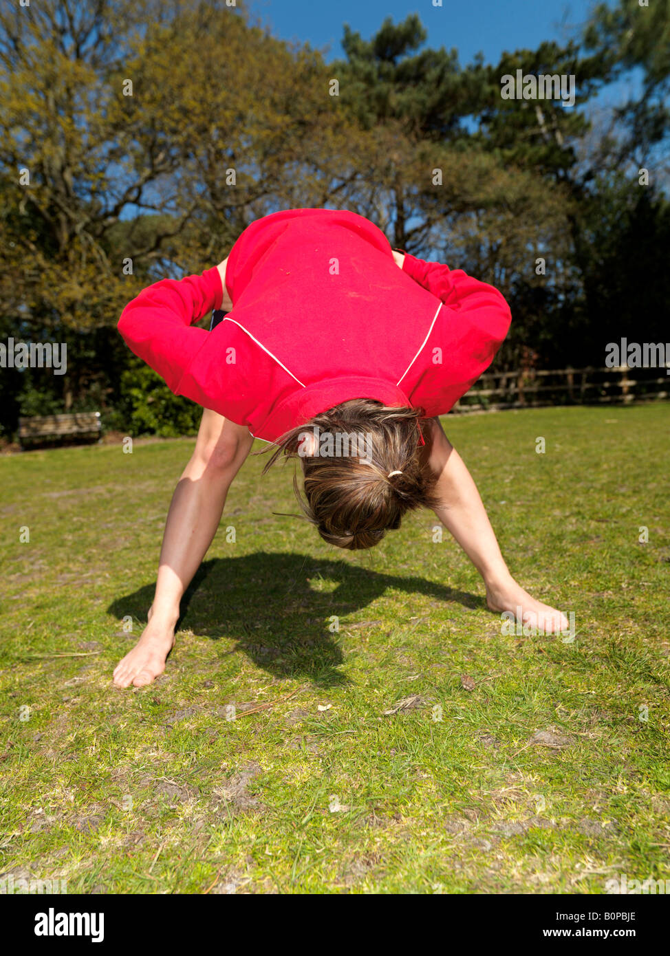 Young Woman Stretching Bending Over Model Released Stock Photo - Alamy