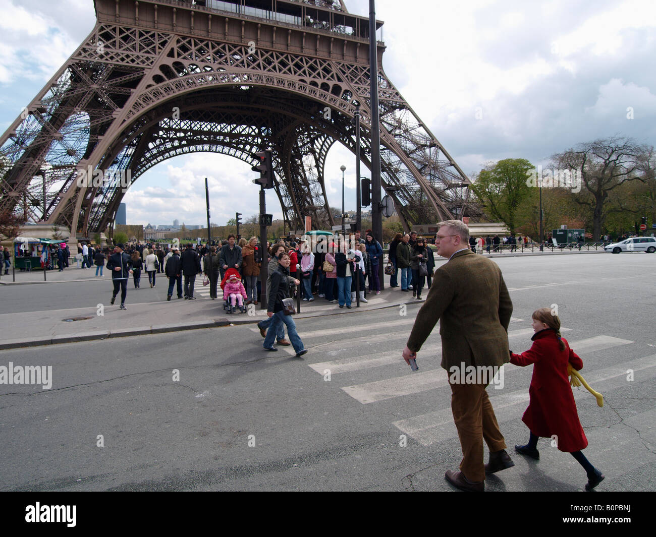People tourists crossing the street near Eiffel Tower Paris France ...