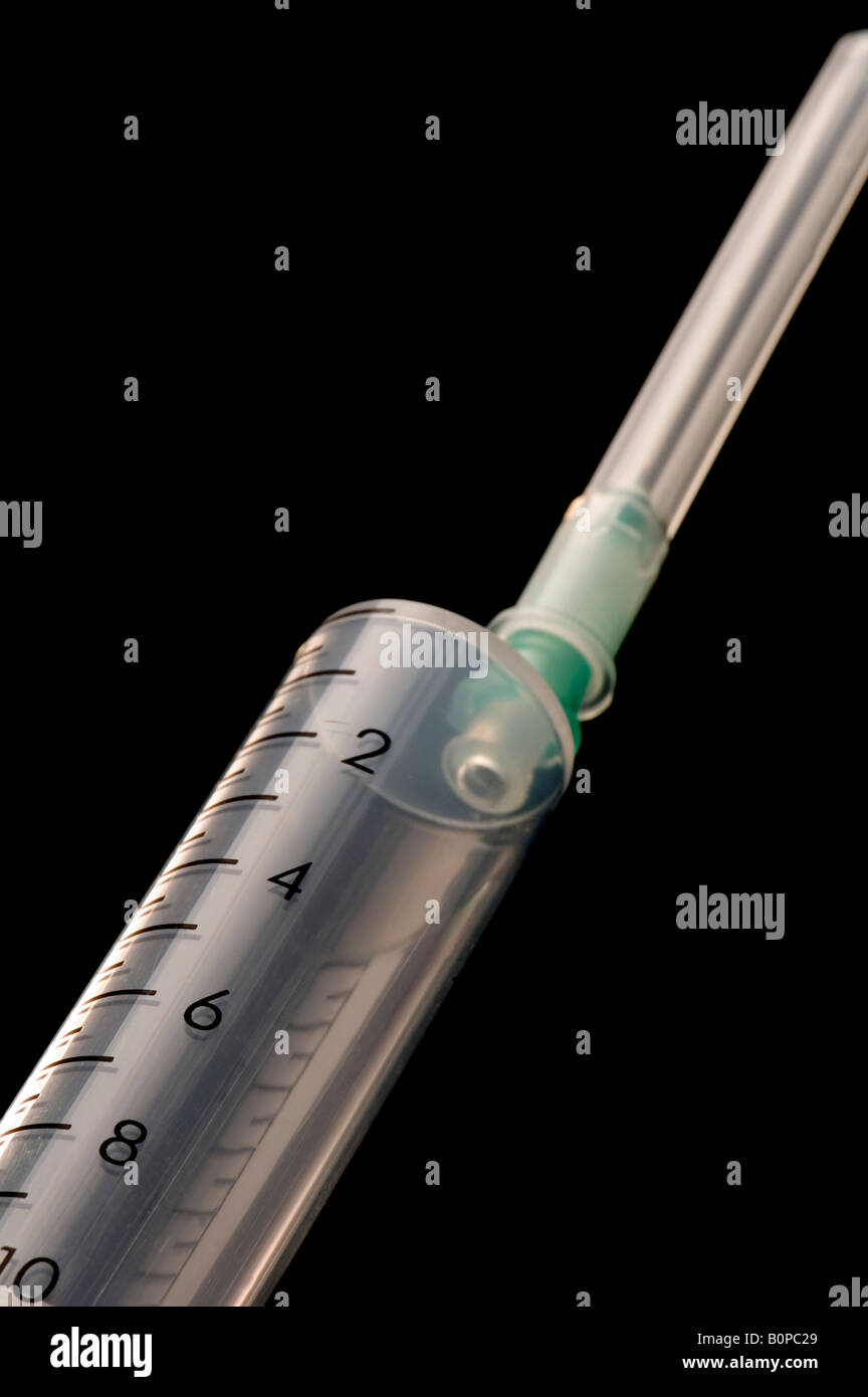 object on black medical tool Syringe Stock Photo - Alamy