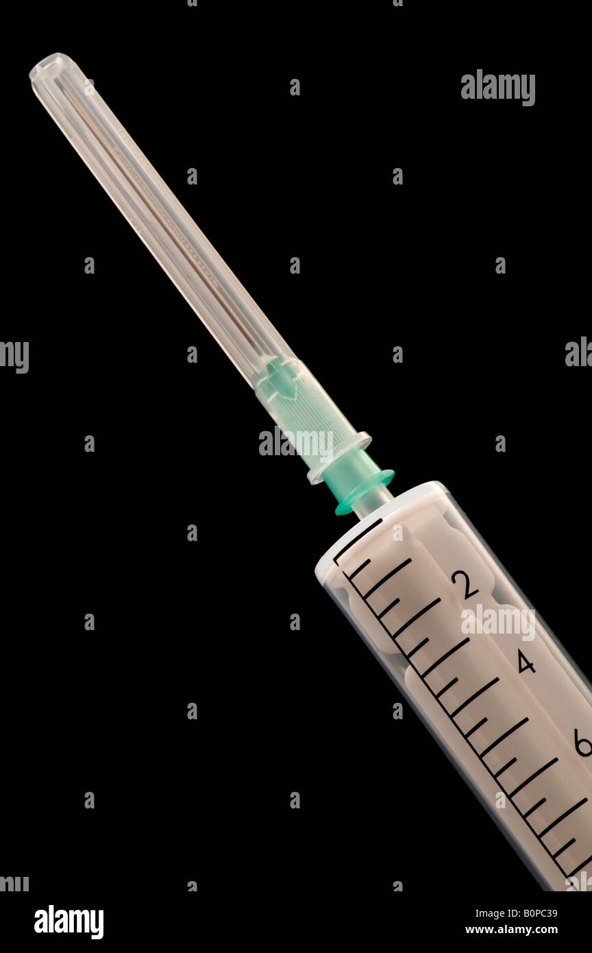 object on black medical tool Syringe Stock Photo - Alamy