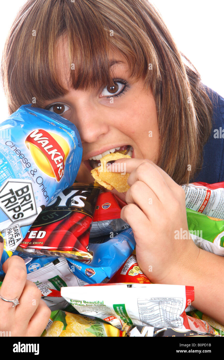 Teenage Girl Eating Crisps Model Released Stock Photo - Alamy