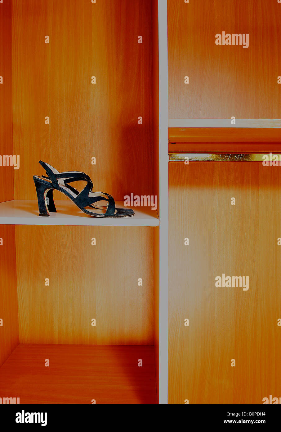 WOMANS HIGH HEEL SHOES ON SHELF IN EMPTY CLOSET Stock Photo - Alamy