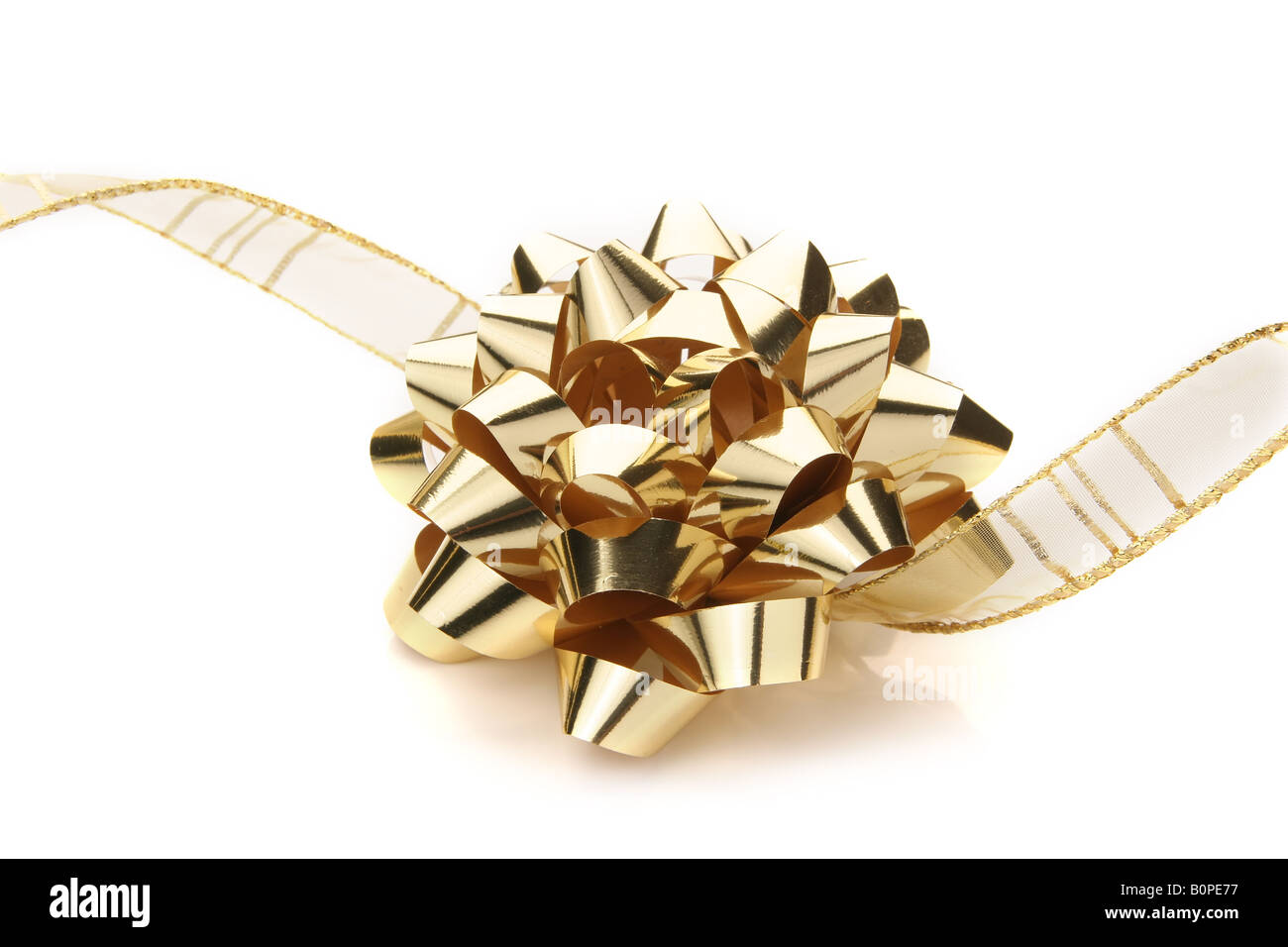 Beautiful golden bow with golden ribbon Stock Photo - Alamy