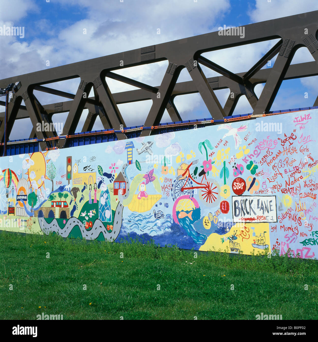 New East London Line bridge section with community artwork on hoarding ...