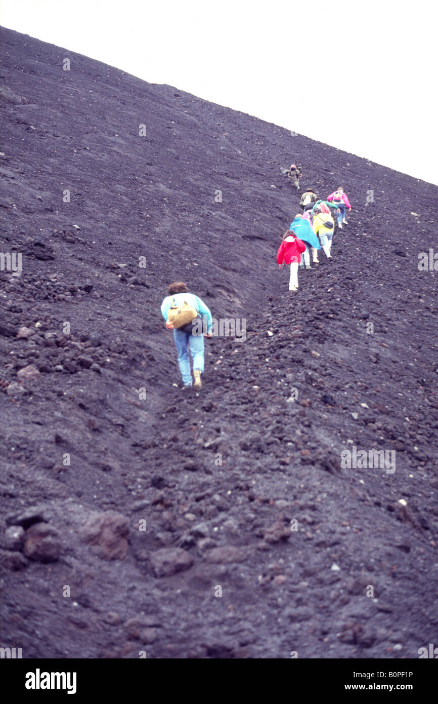 Tourist walk up volcanic cone of active Pacaya volcano, Guatemala Stock ...