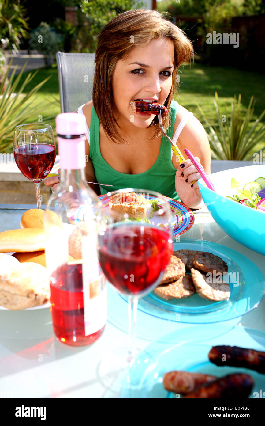 Young Woman Eating Sausage Model Released Stock Photo - Alamy