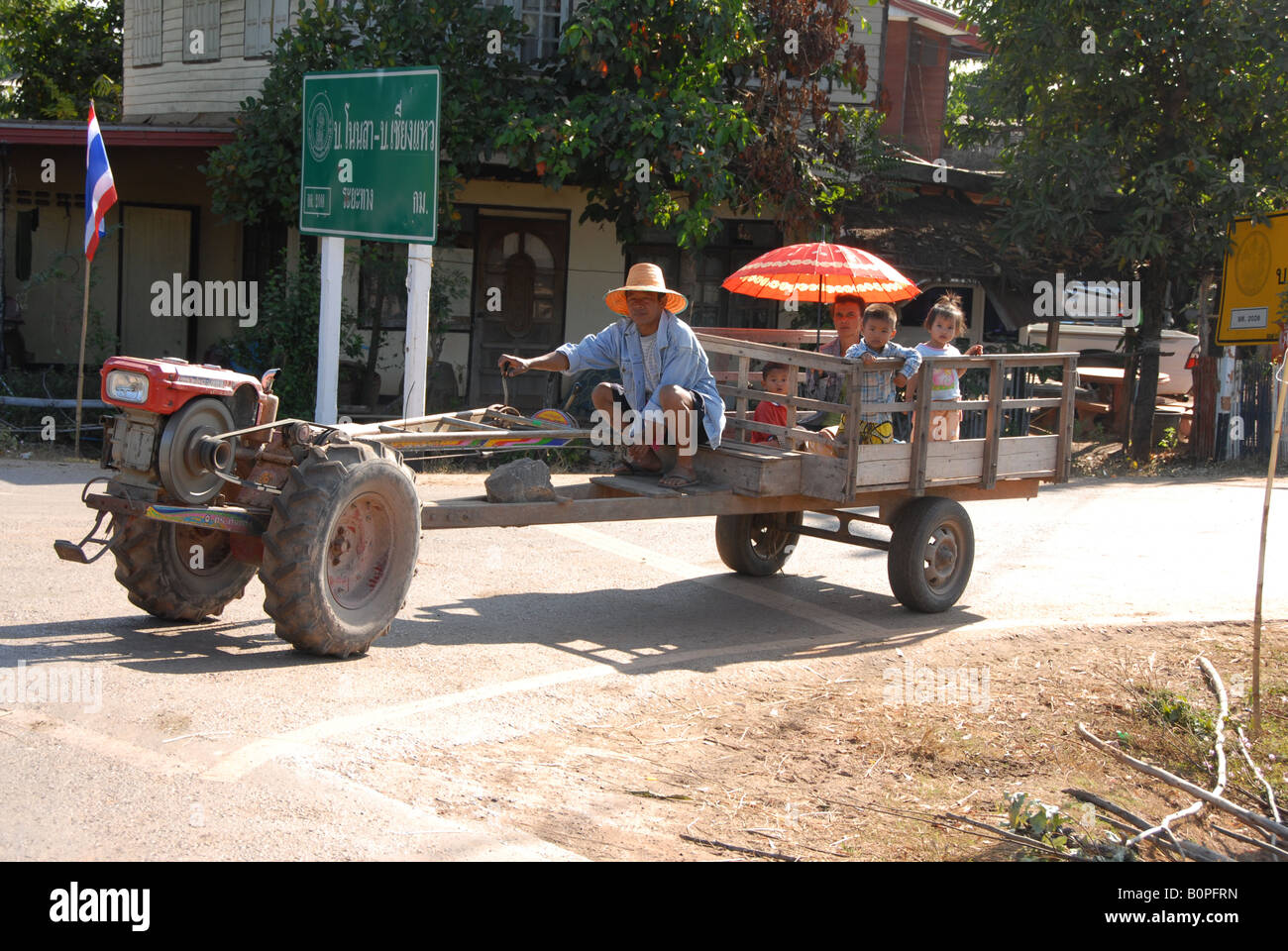 cultivator vehicle is applied to rickshaw for carrying family to rice ...