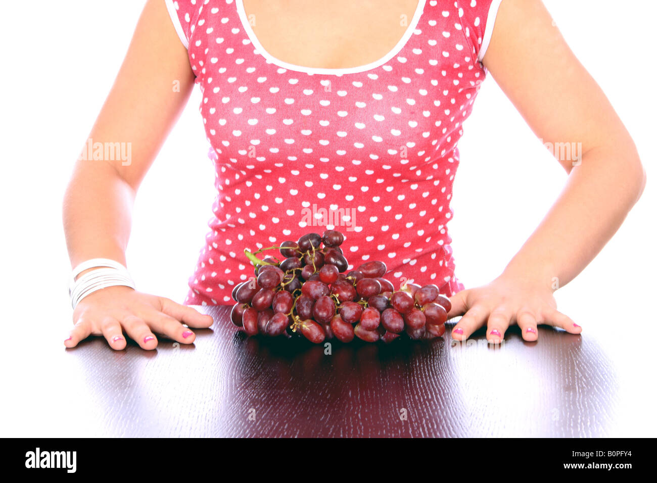 Young Woman with Red Grapes Model Released Stock Photo - Alamy