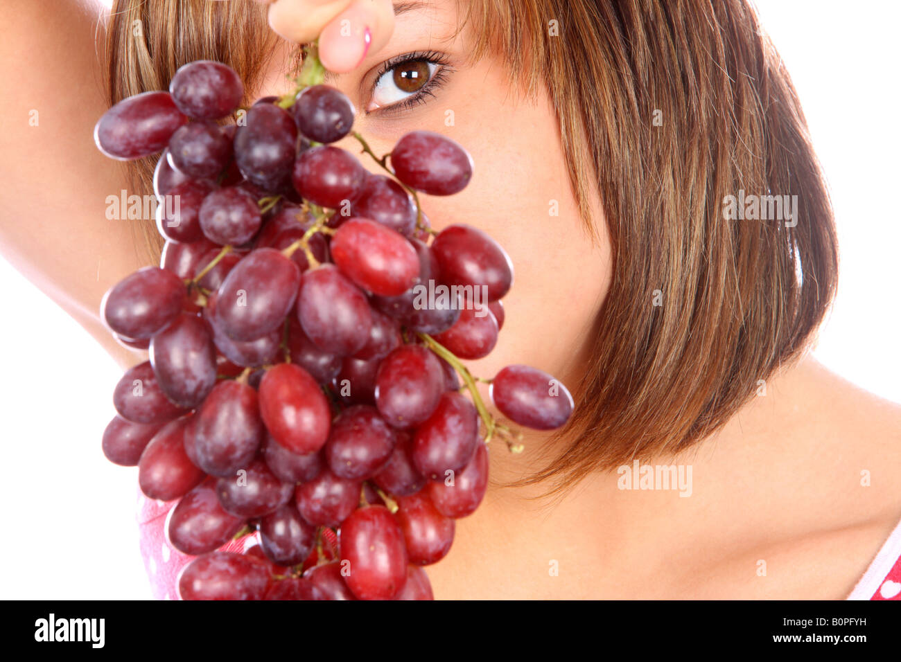 Young Woman Holding Red Grapes Model Released Stock Photo - Alamy