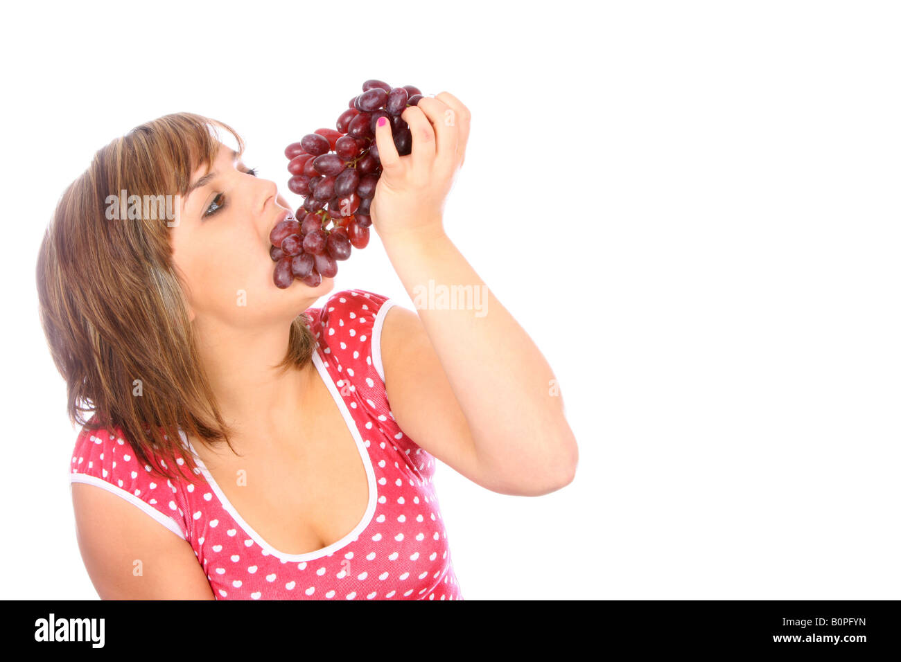 Young Woman Eating Red Grapes Model Released Stock Photo - Alamy