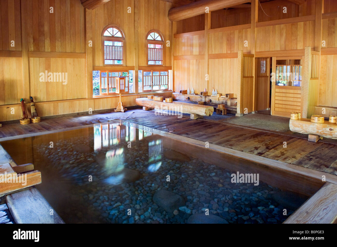 Japanase onsen showing the wash area with the actual bathing area in ...