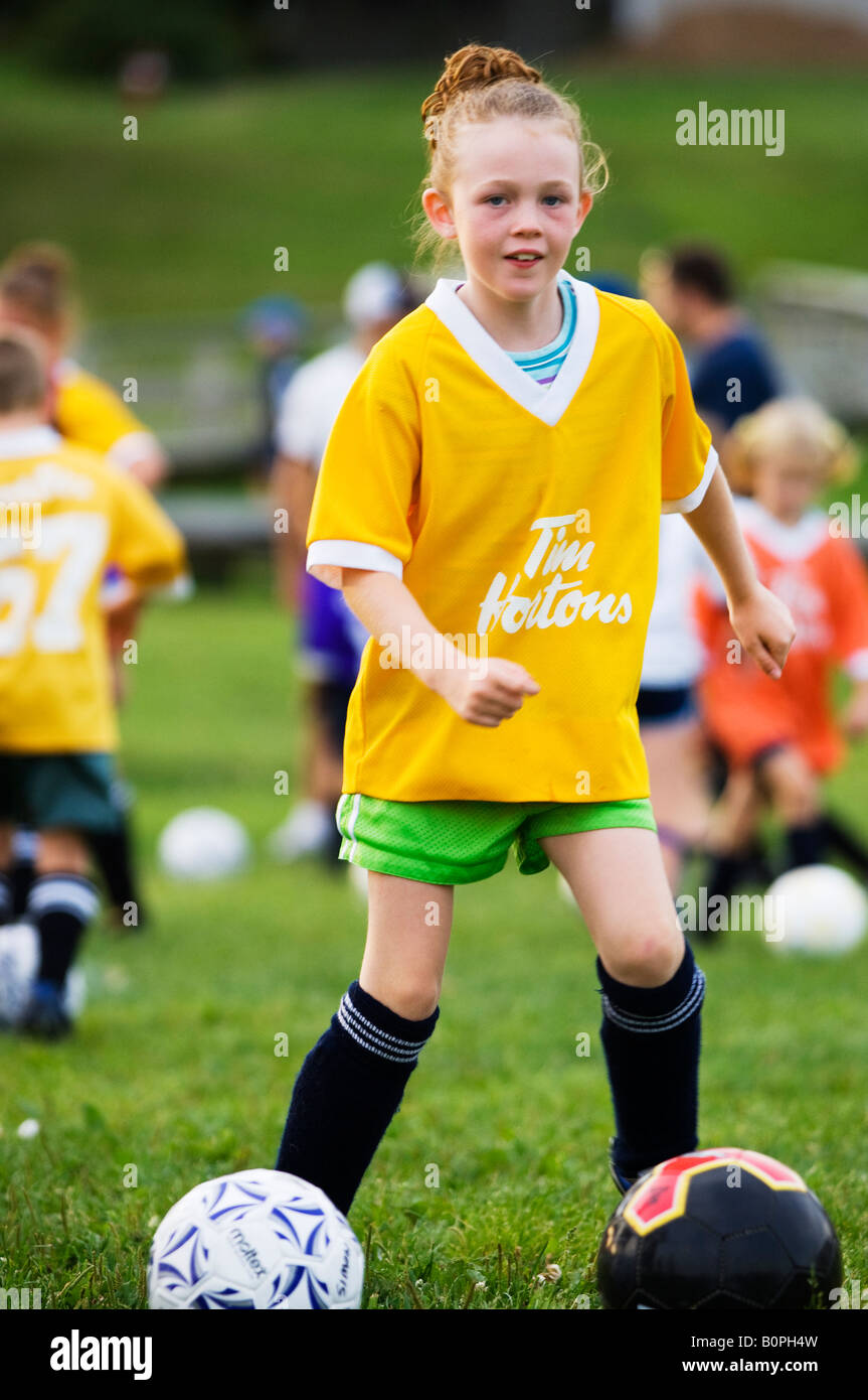 Practicing soccer on grassy field hi-res stock photography and images ...
