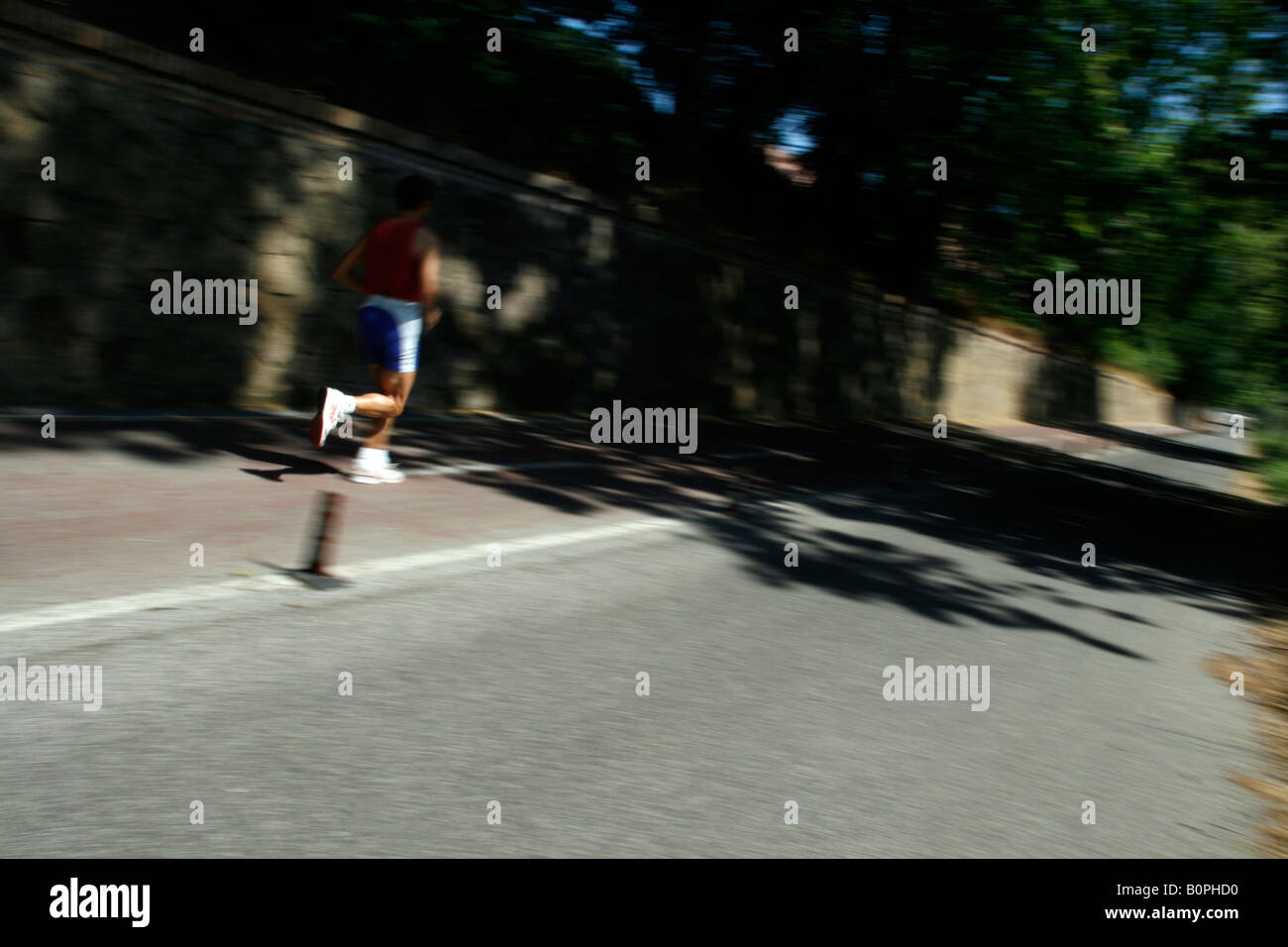 one fast runner in countryside Stock Photo - Alamy