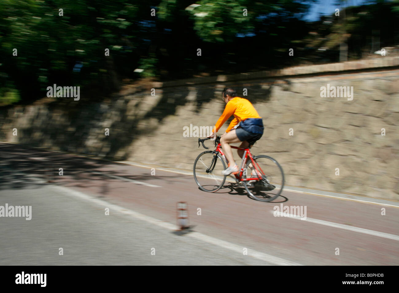 one fast bike rider in countryside Stock Photo - Alamy