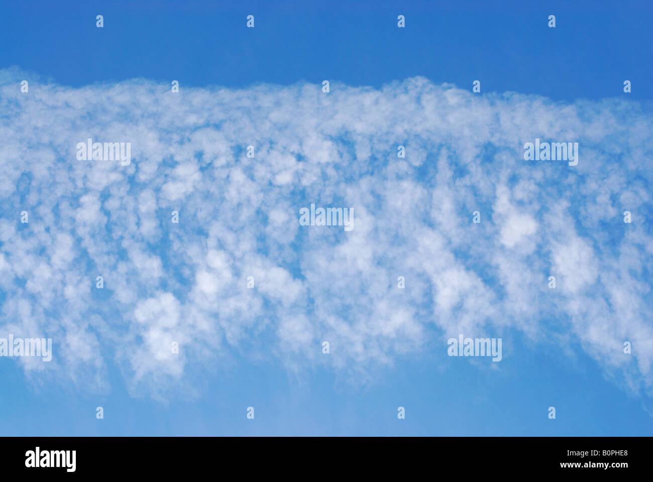 vapor trails or chemtrails from jets in sky often forming grid or ...