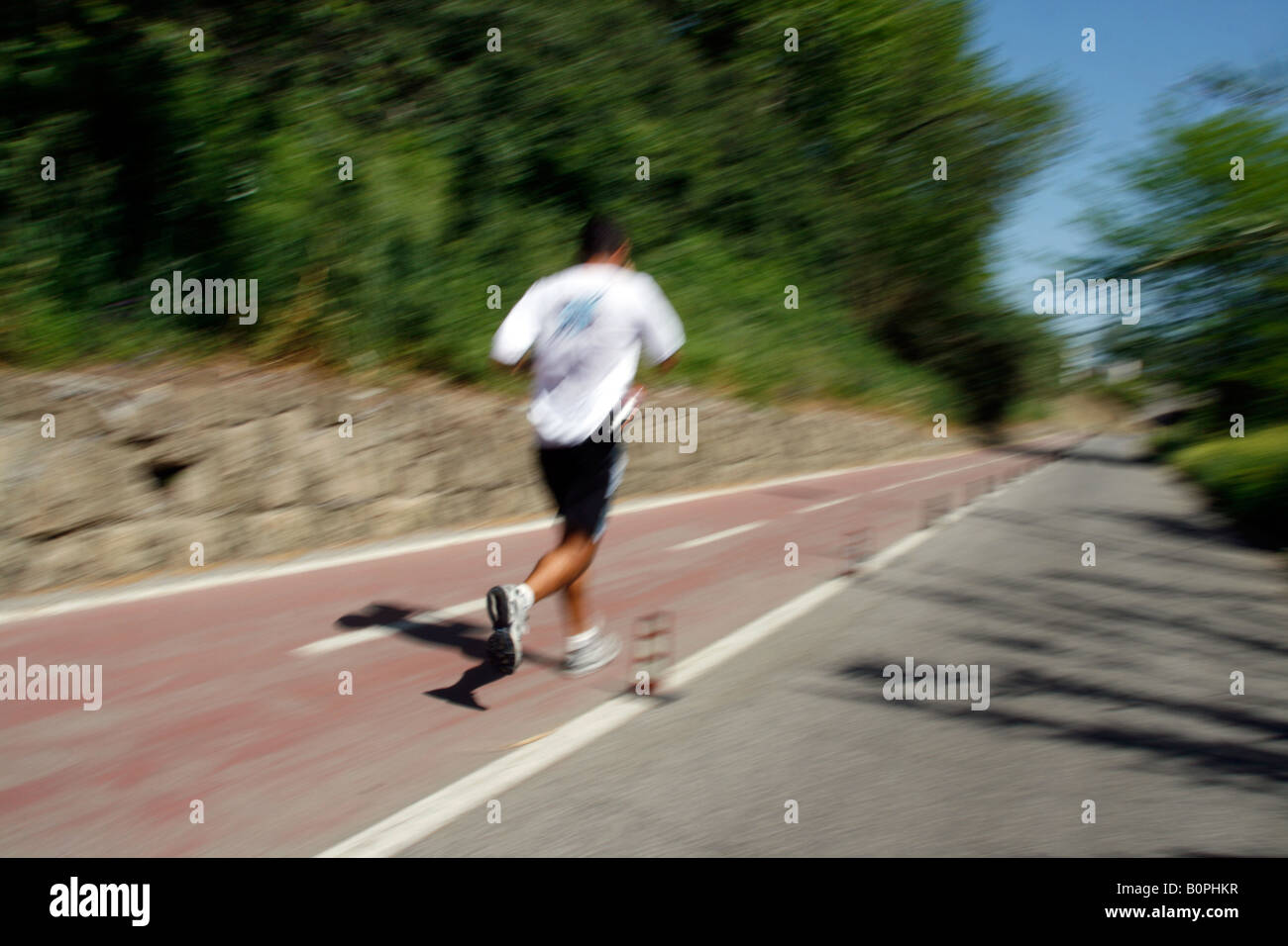 one fast runner in countryside Stock Photo - Alamy