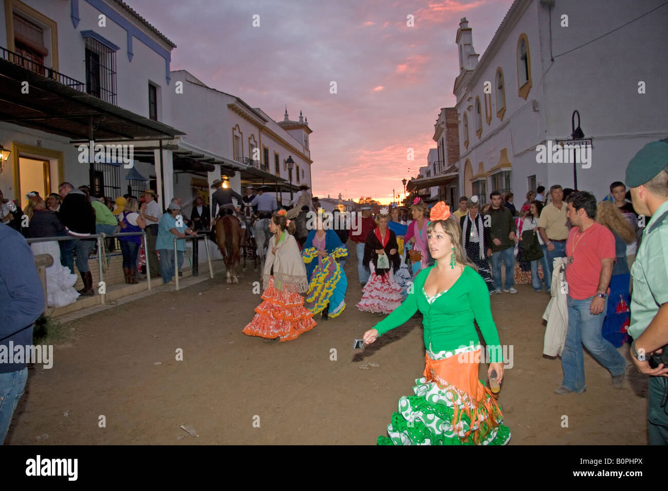 people walking through El Rocío in the evening Stock Photo - Alamy