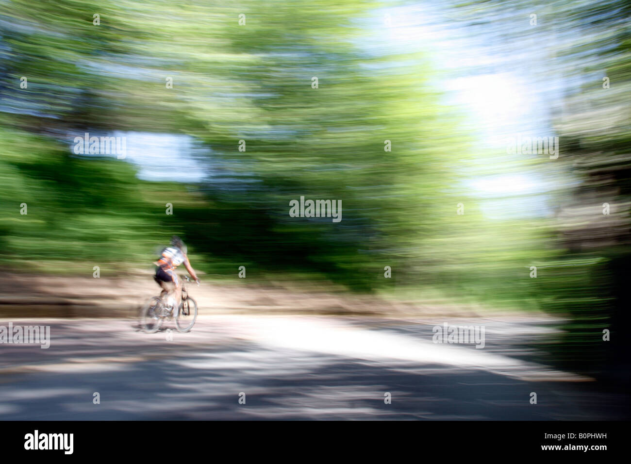 one fast bike rider in countryside Stock Photo - Alamy