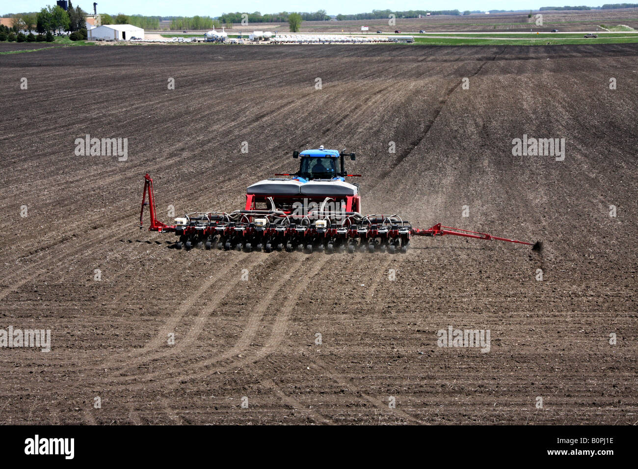 Tractor and planter from rear in field Stock Photo - Alamy