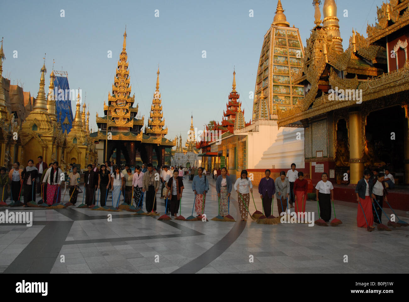 burmese people are sweeping dust at shewedagon pagoda, rangoon, burma ...