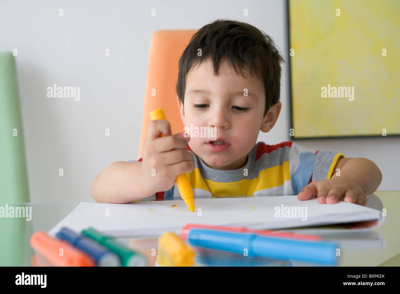 Little boy is colouring Stock Photo - Alamy