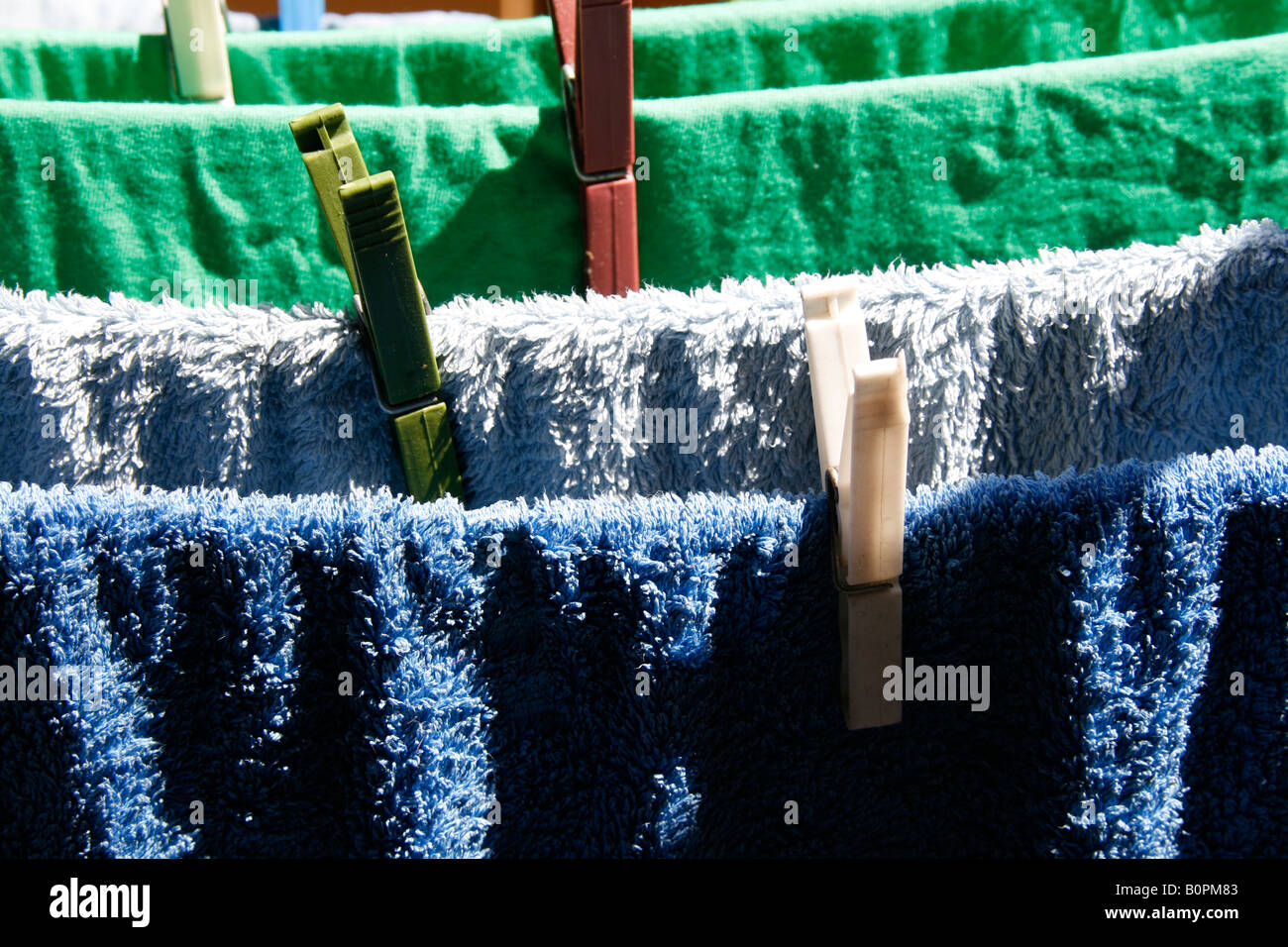 wet towels hanging on washing line Stock Photo - Alamy