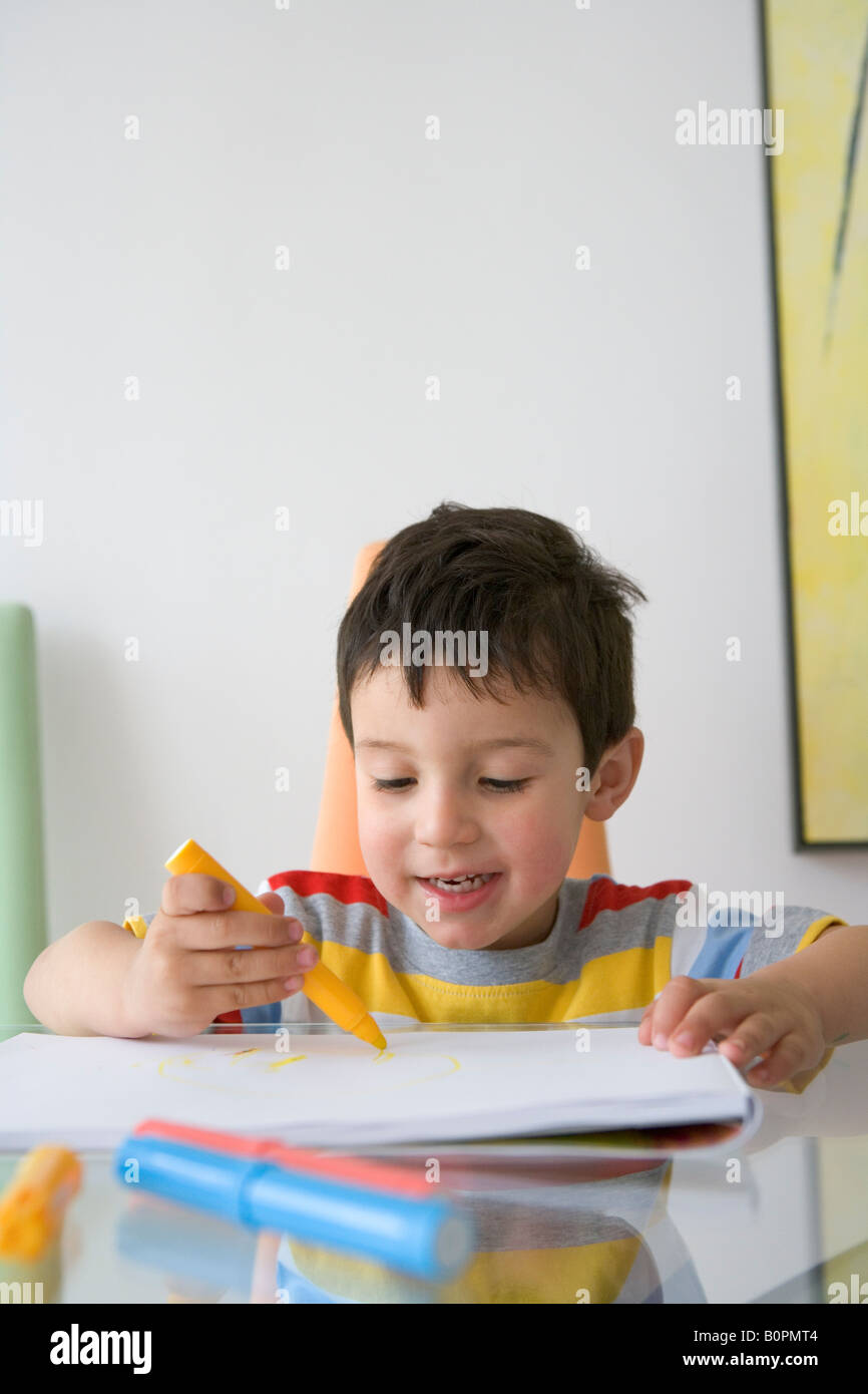 Little boy is colouring Stock Photo - Alamy