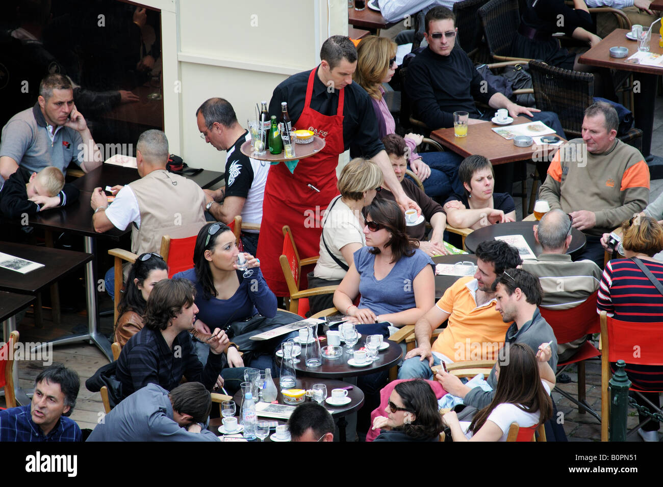 Customers outside a restaurant in the Place Chateaubriand in St Malo ...
