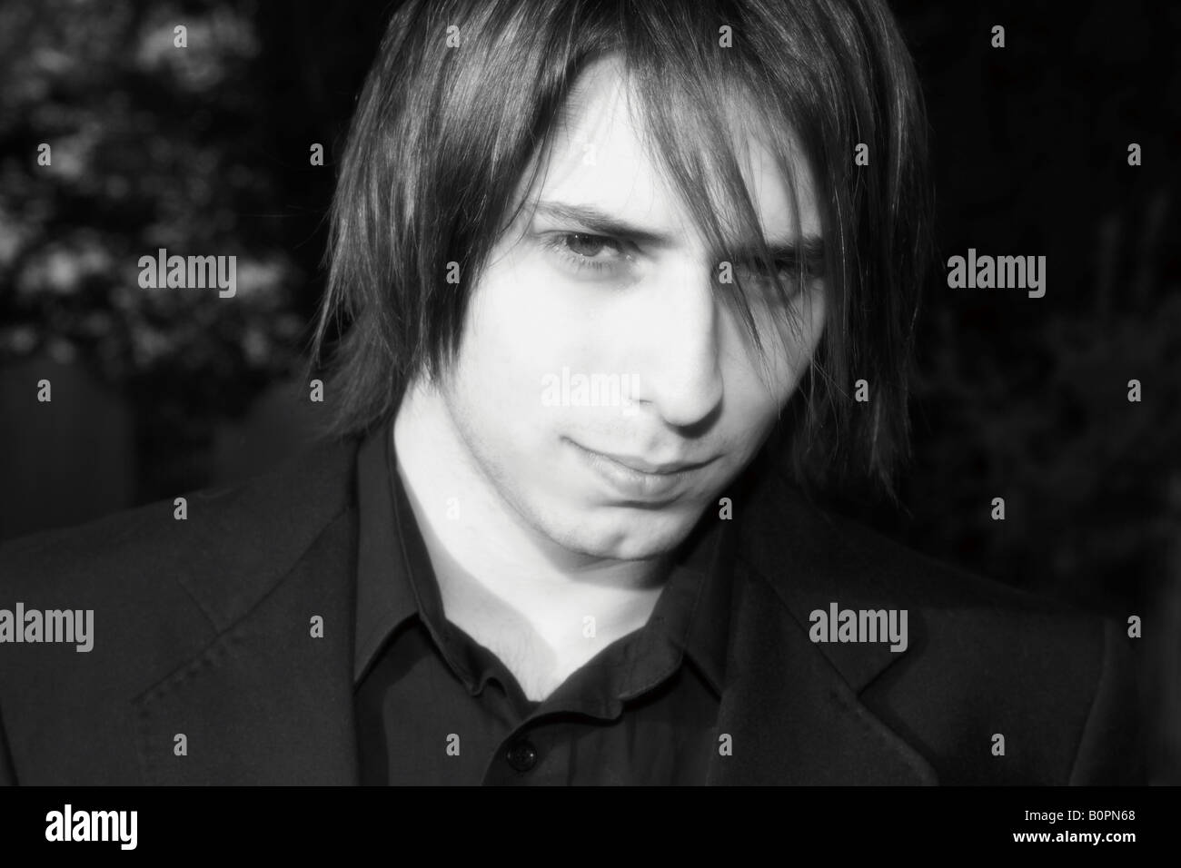 Young man with strong gaze in the evening sunlight Stock Photo - Alamy