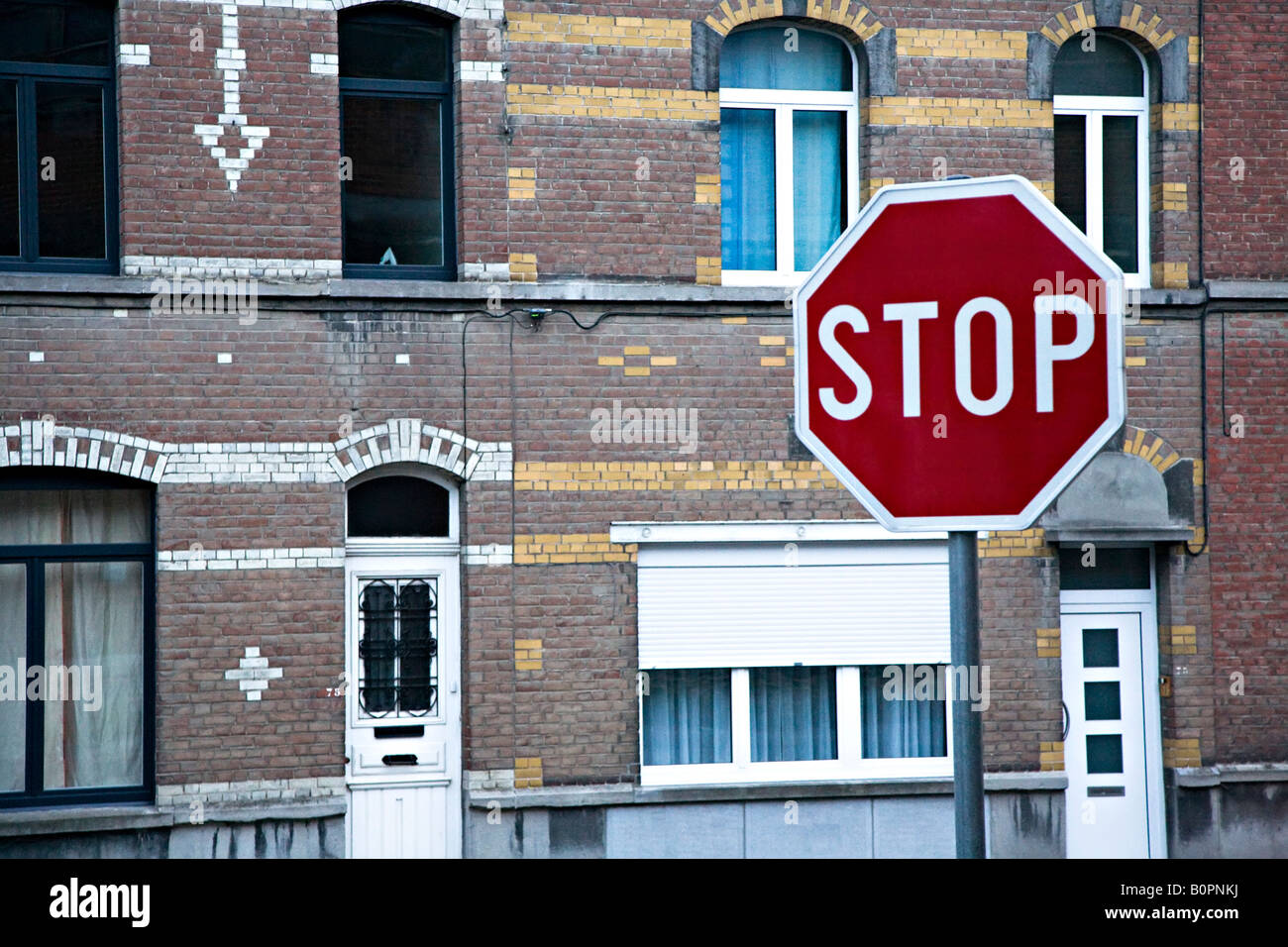 Stop road traffic sign in residential street Belgium Stock Photo - Alamy